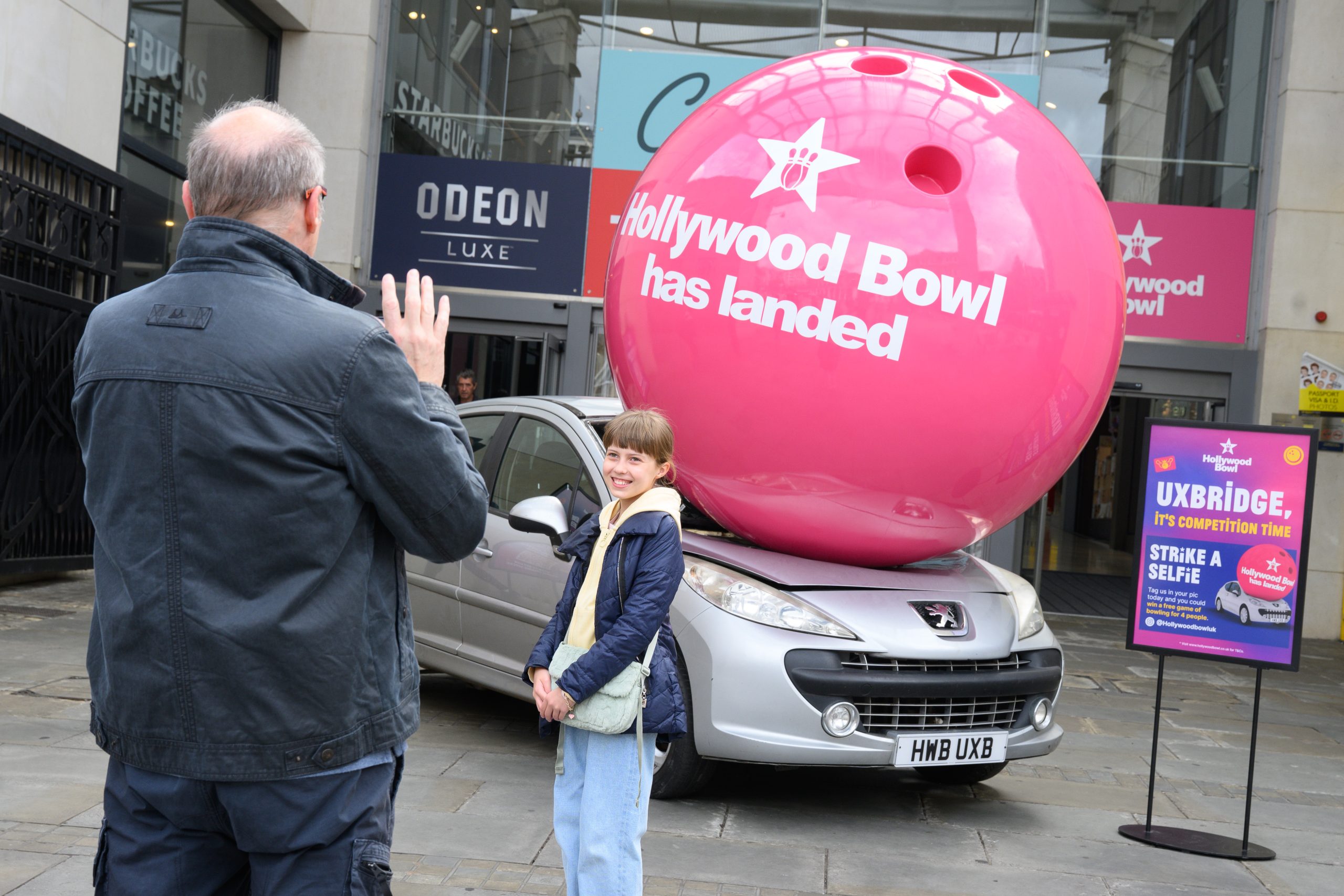 A giant bowling ball crash lands in Uxbridge to launch Hollywood Bowl ...